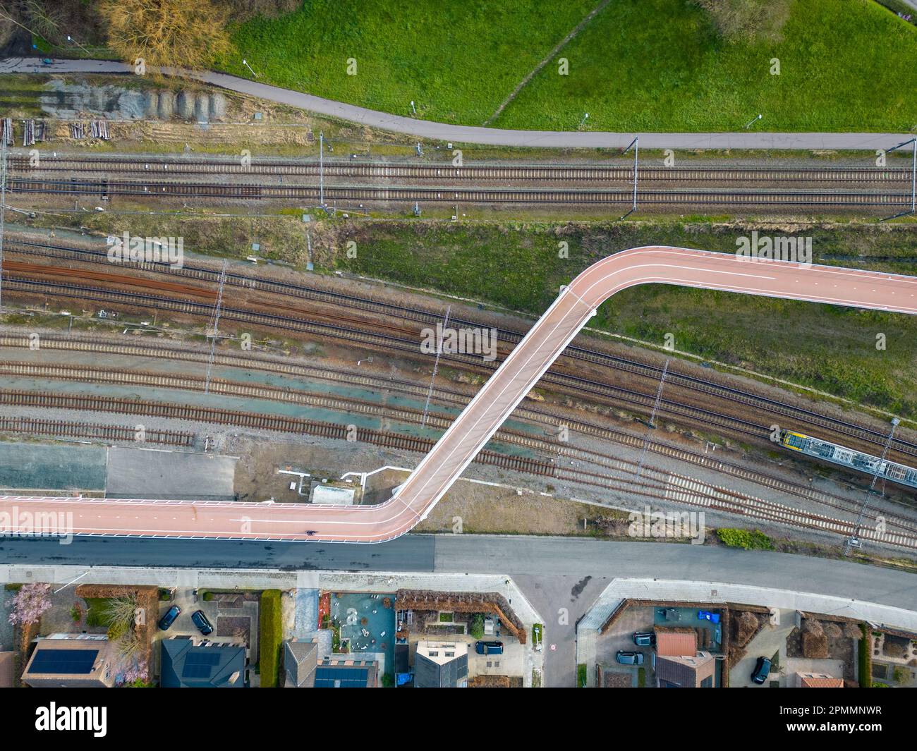 Aerial view shot by a drone of a cyclists and pedestrian bridge over ...