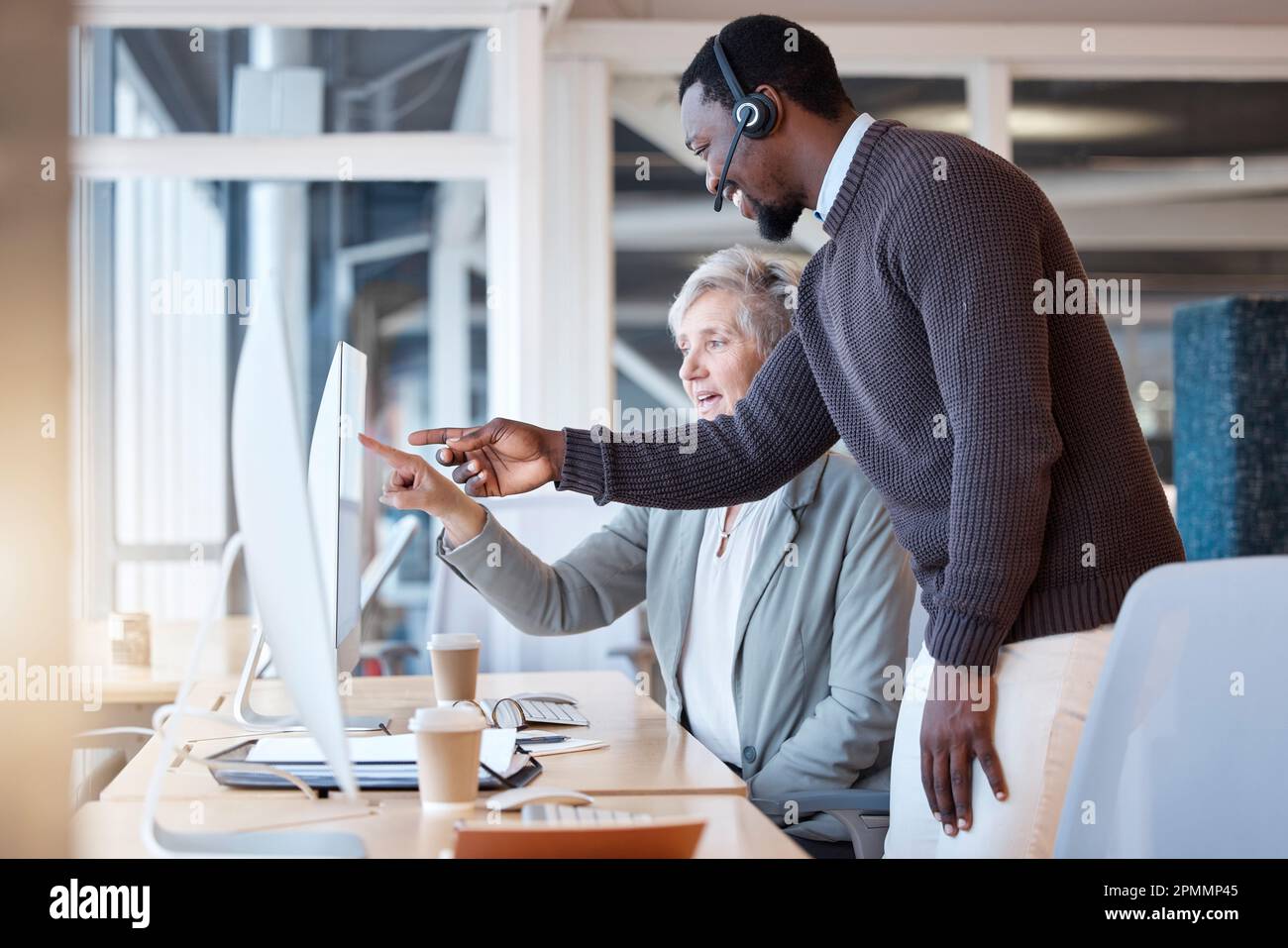 Call center, black man and coach training worker in customer service or ...