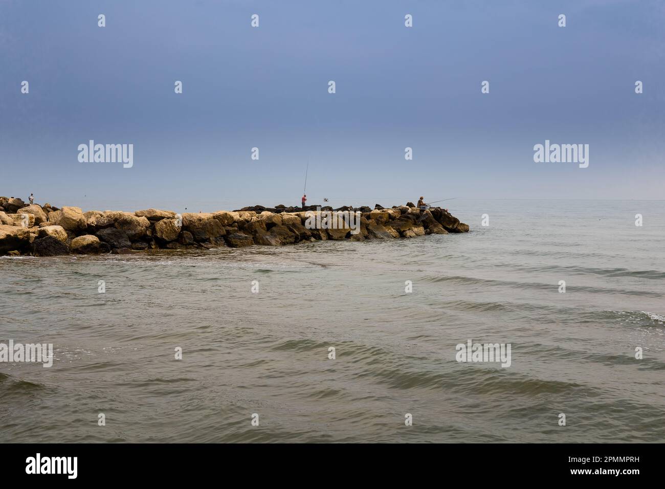 Rustic beach with rocks and sand Stock Photo - Alamy