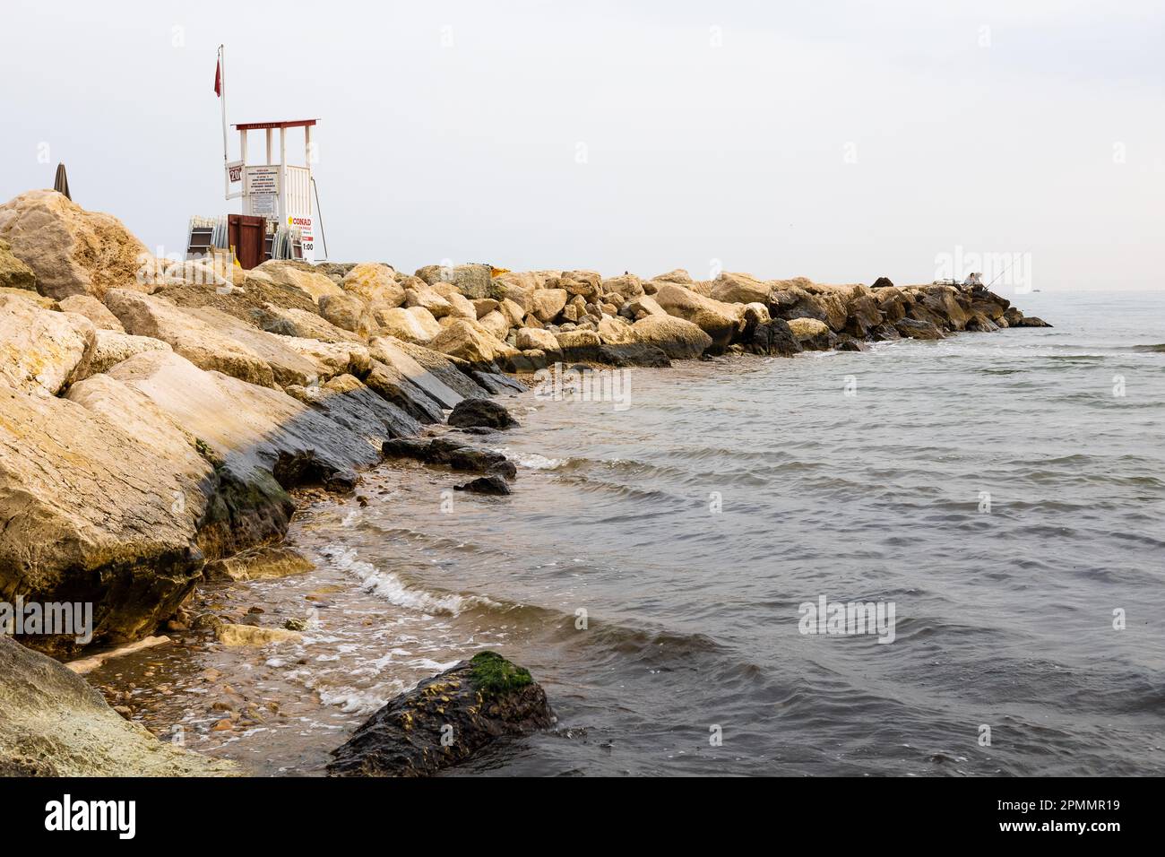 Rustic beach with rocks and sand Stock Photo - Alamy