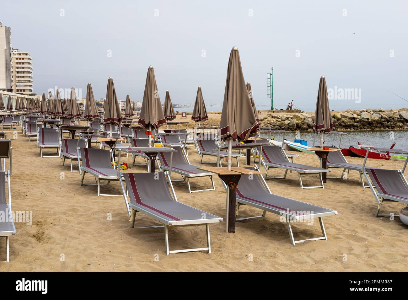 Rustic beach with rocks and sand Stock Photo - Alamy