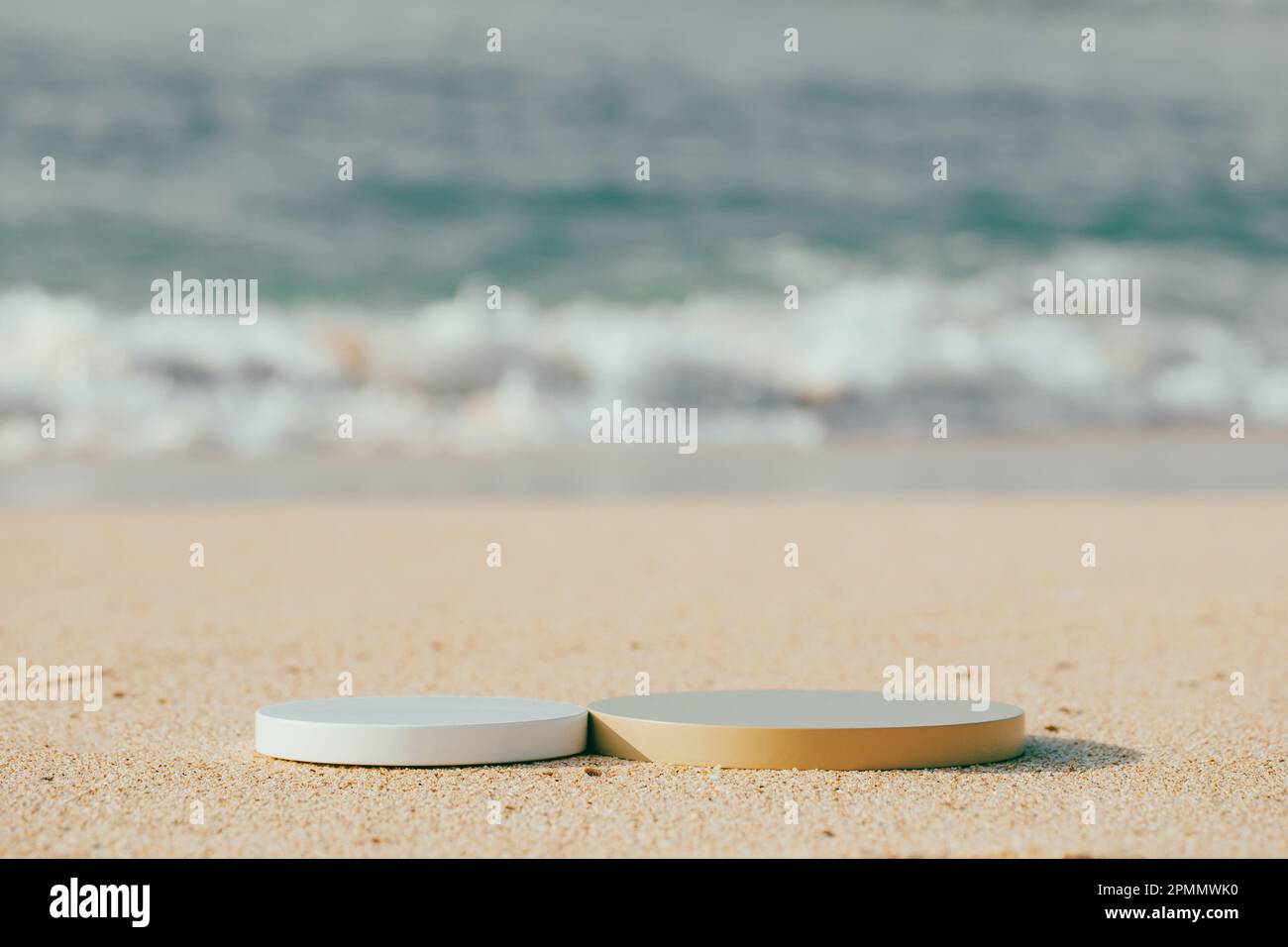 Two empty round platform podiums on the beach sand Stock Photo - Alamy
