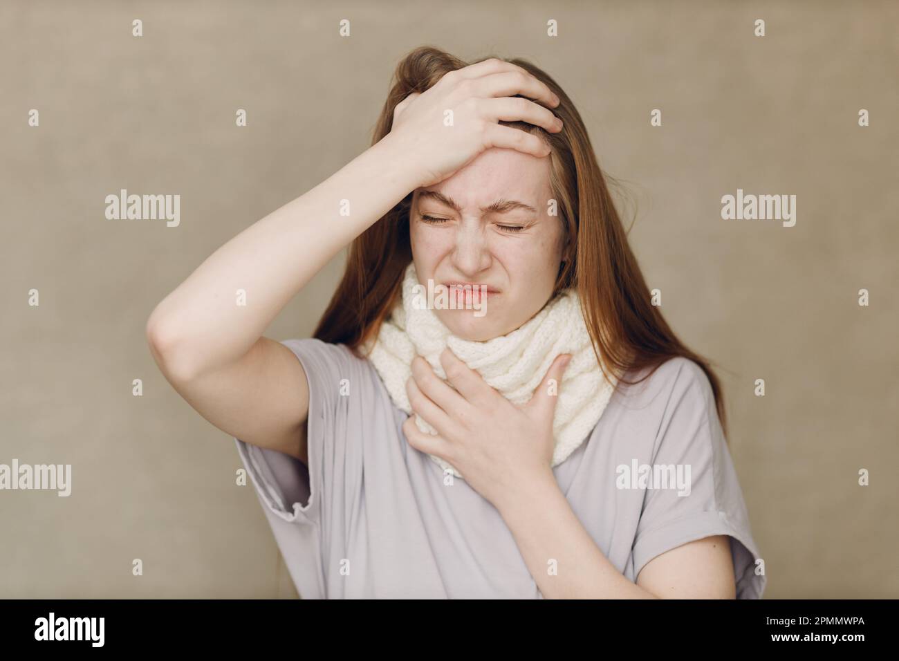 Young woman wearing scarf flu catarrh ill sick disease treatment cold ...