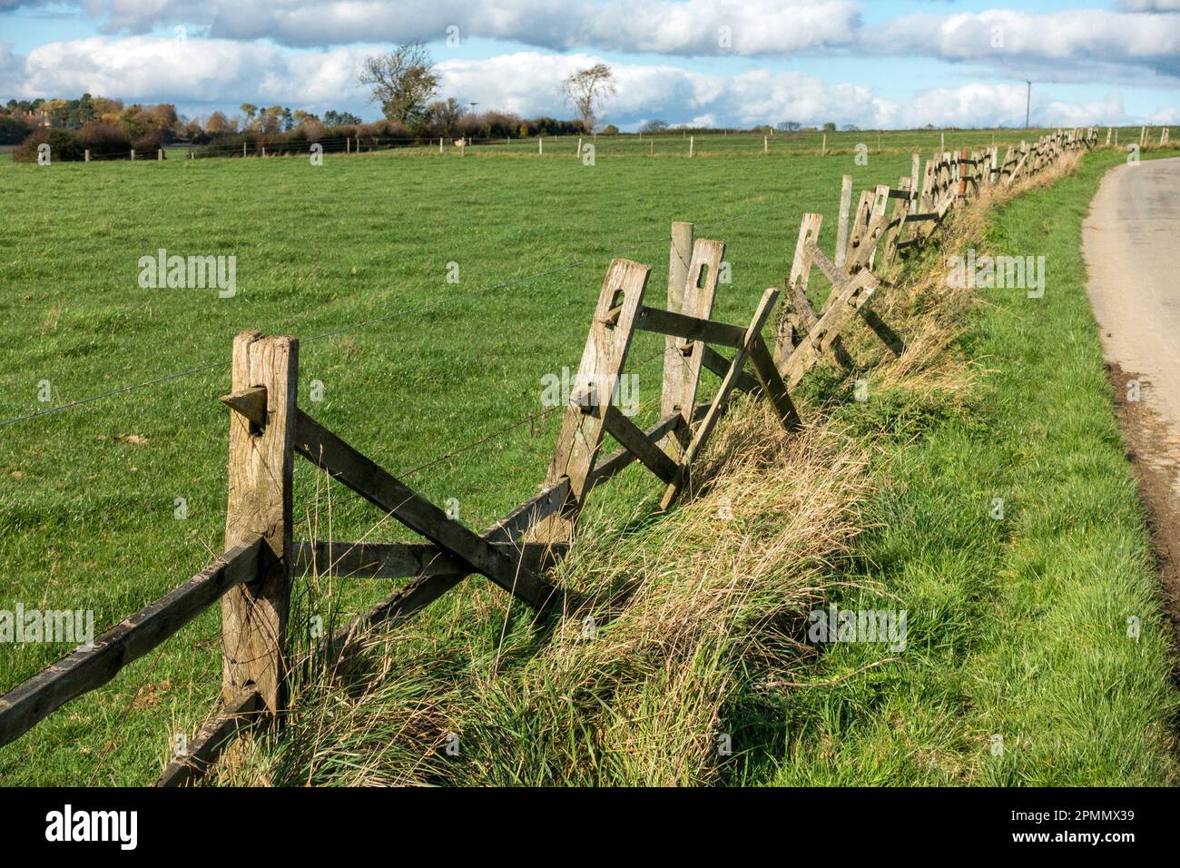 Old rotten, dilapidated, broken, tumbledown, wooden post and rail fence ...