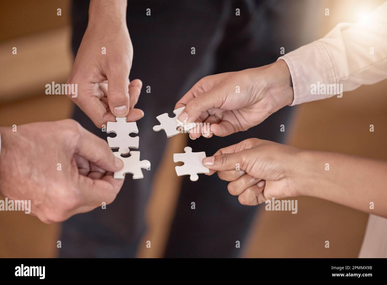 Business people, hands and puzzle piece in planning, collaboration or ...