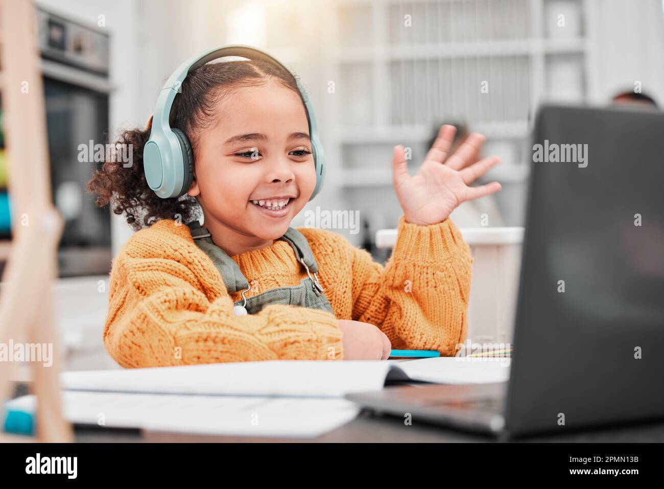 Elearning, online class and child wave on a internet call with laptop ...