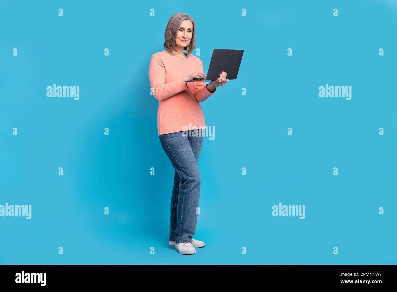 Full Length Body Cadre Of Confident Freelancer Pensioner Woman Hold Laptop Internet Coding