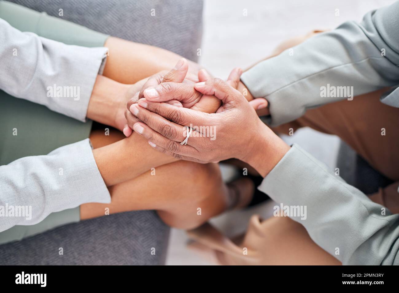 Women holding hands for therapy support, empathy and help with ...