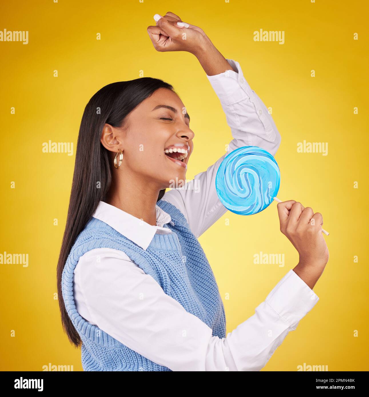 Candy, sing and woman with lollipop, happy and cheerful against a ...