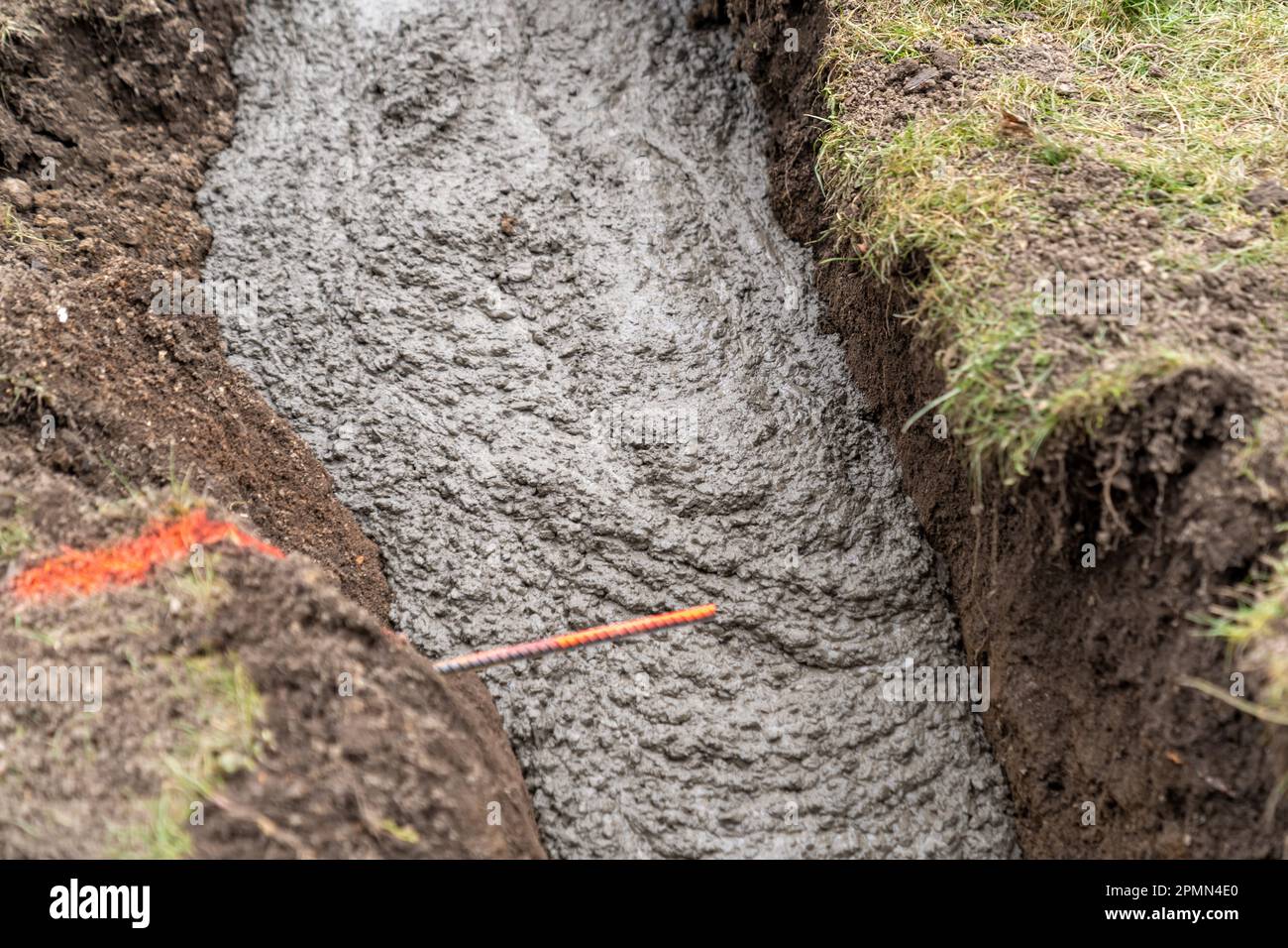 cementing the foundation in the ground when building a house Stock ...