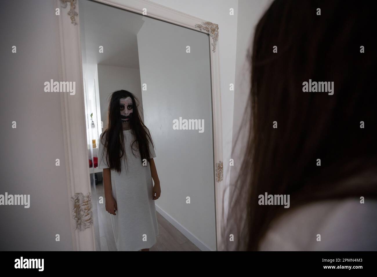 scary girl in white dress from horror film Stock Photo - Alamy
