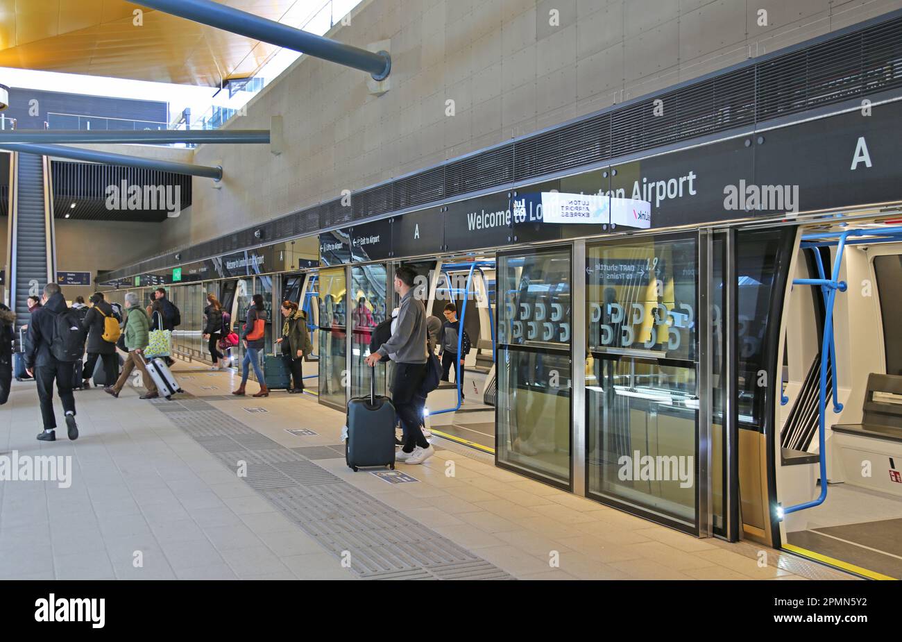 Passengers leave the new Luton Airport DART passenger transit system ...