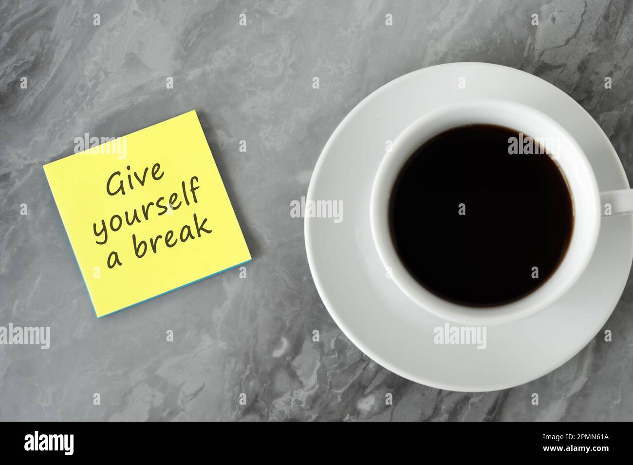 Cup of coffee and adhesive note with text Give yourself a break Stock ...