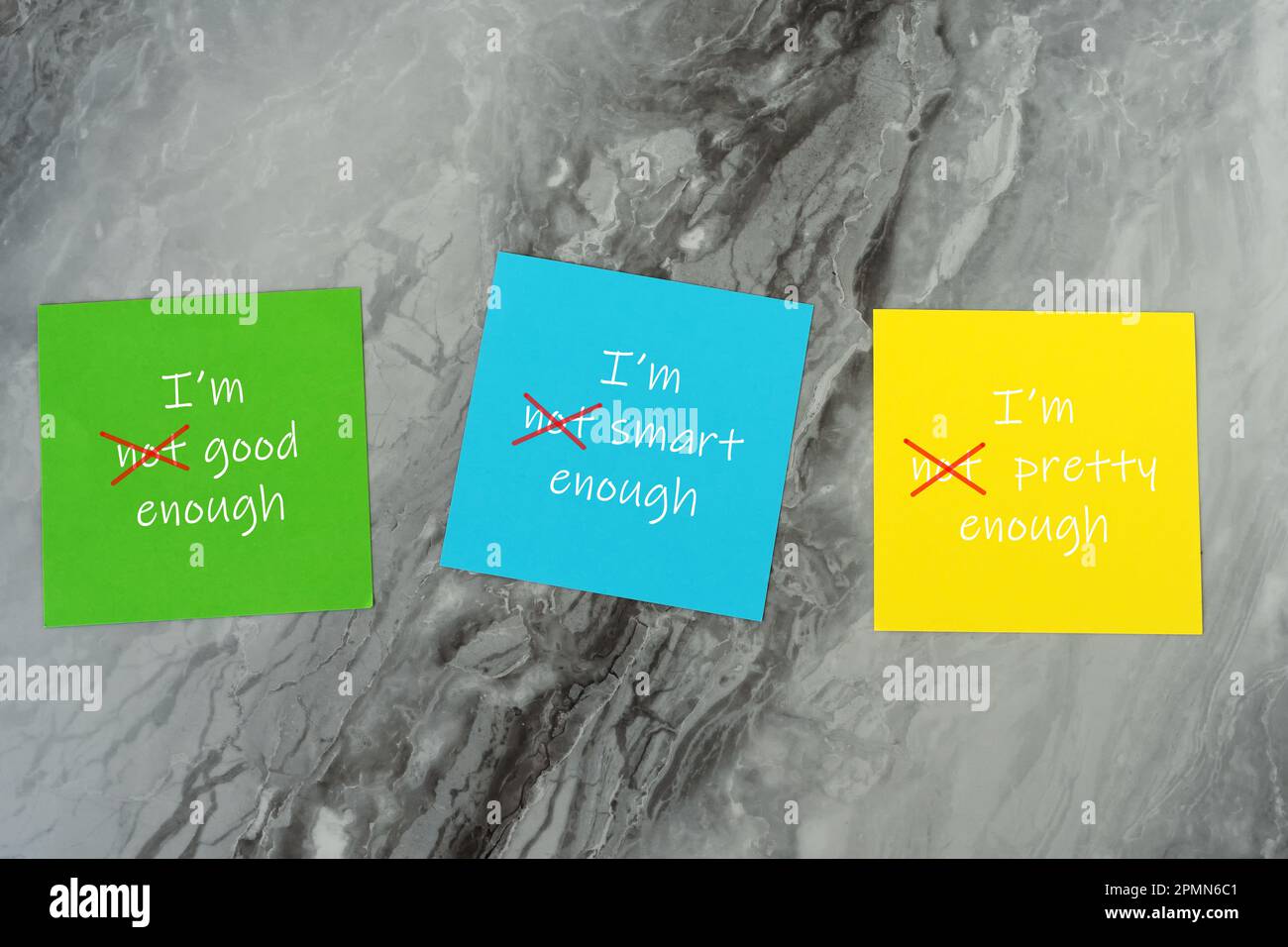 Three colorful paper notes with text I'm not good enough, I'm not smart ...