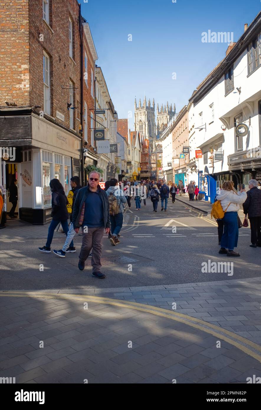 Low Petergate in York looking toward the cathedral towers Stock Photo ...