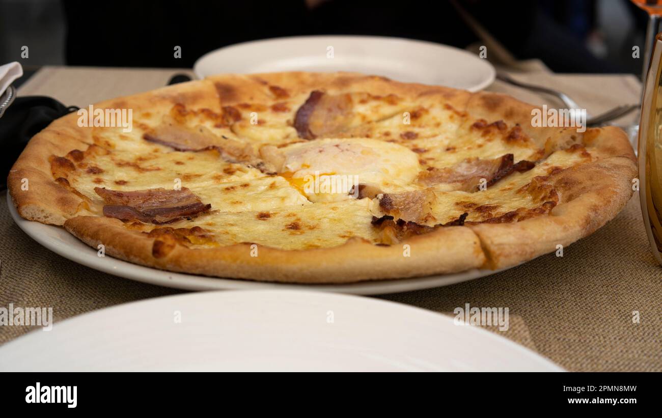 Original Italian Tasty appetizing pizza with ham and cheese close-up ...