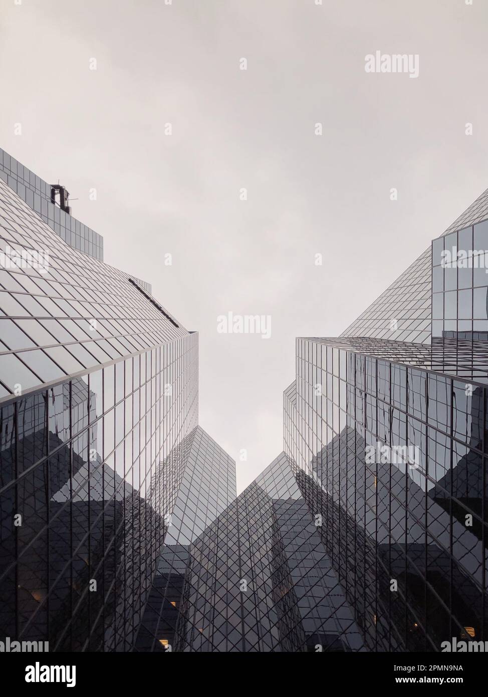 A modern office building exterior with a clear sky above Stock Photo ...