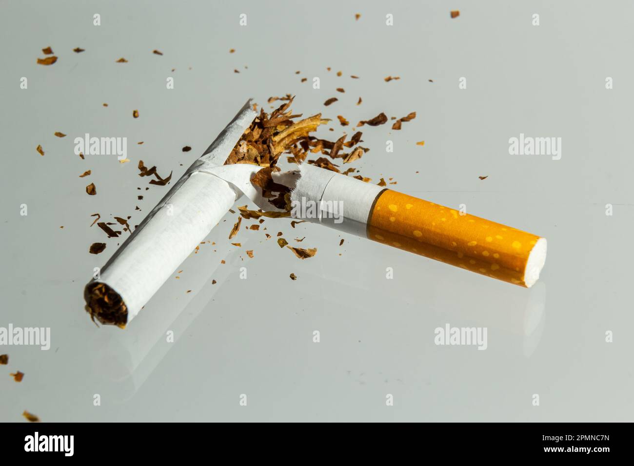 Broken cigarette fly in air on a light background. Conception of ...