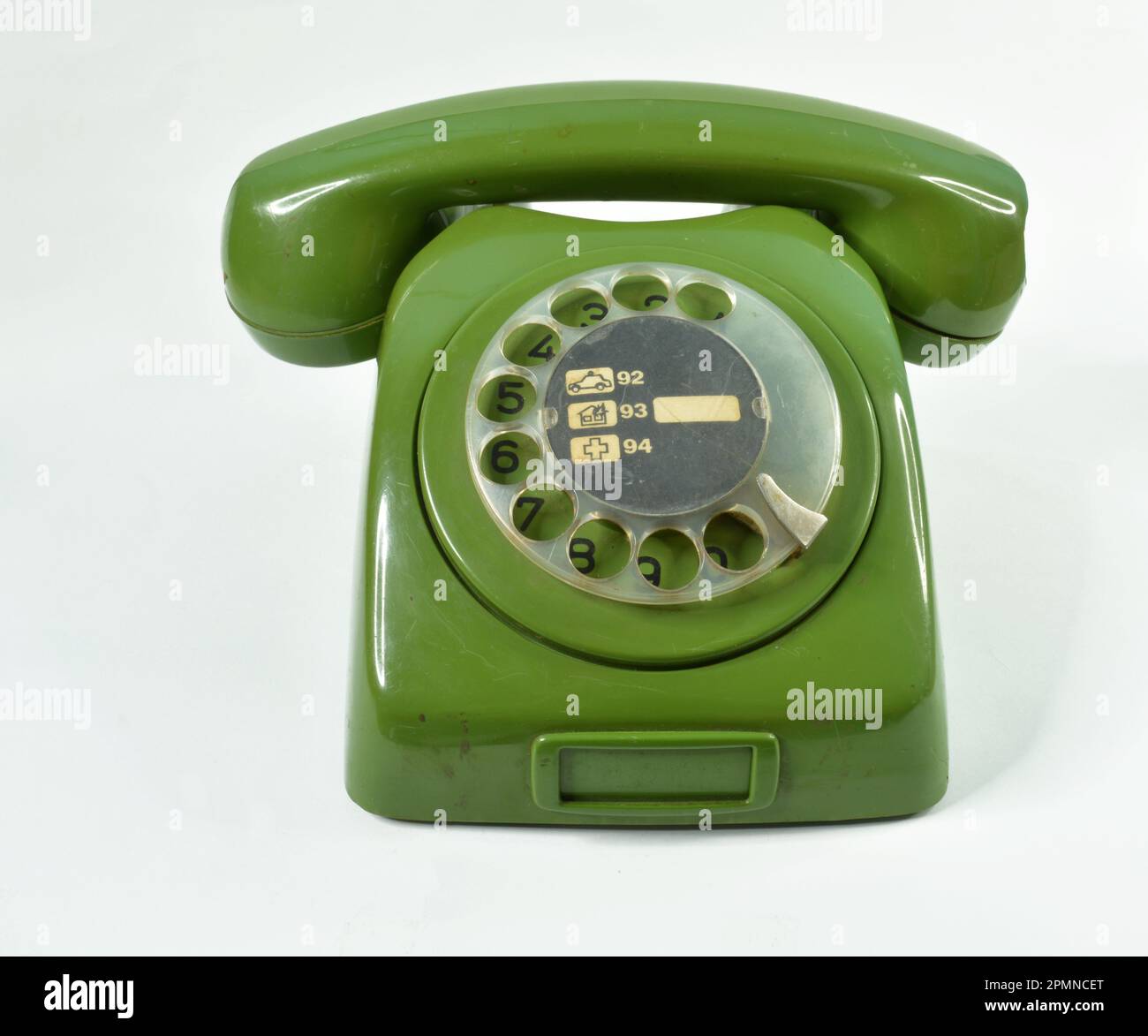 Retro green dial phone with emergency numbers on white background Stock ...