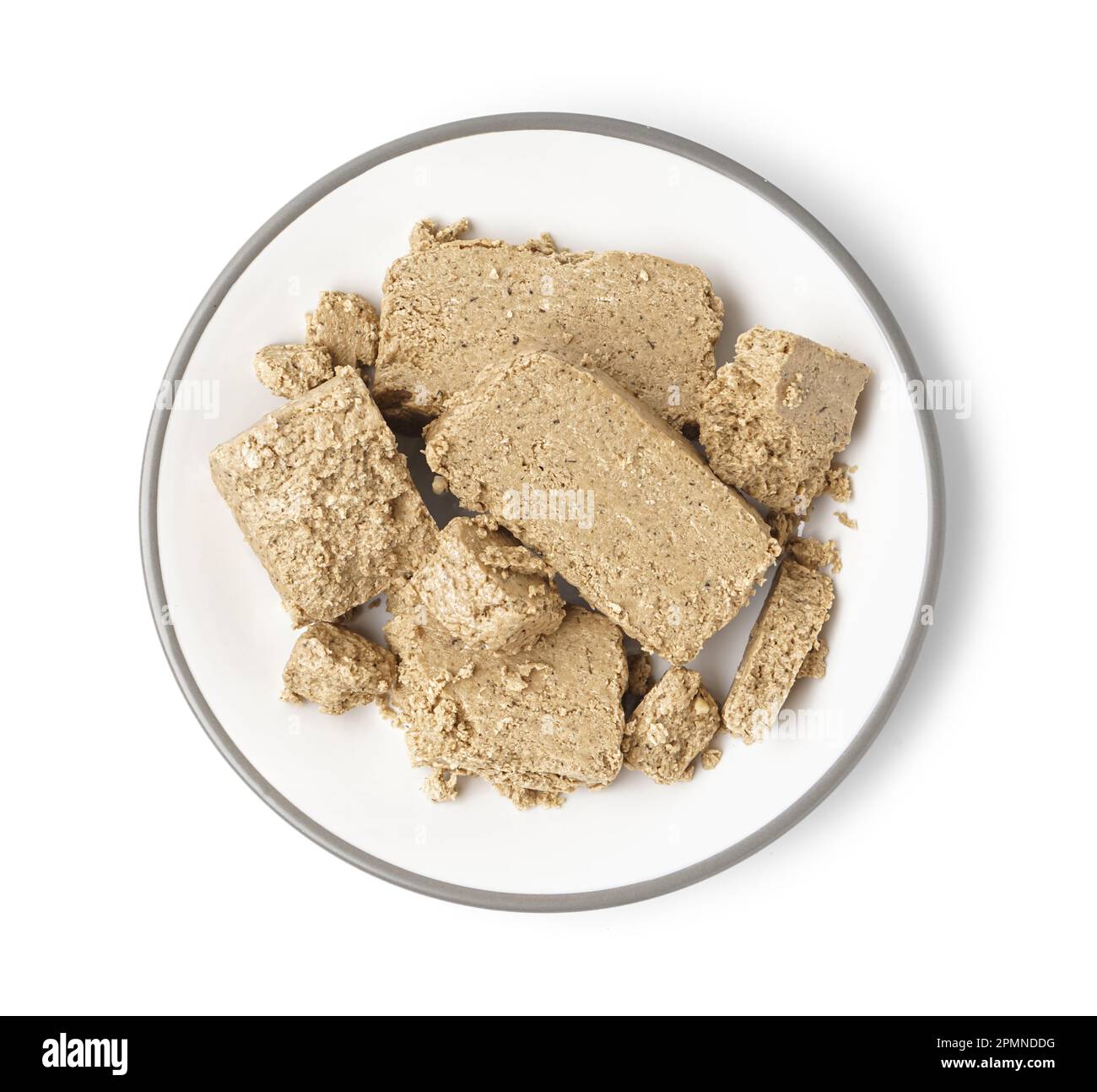 Plate with pieces of sweet halva on white background Stock Photo - Alamy