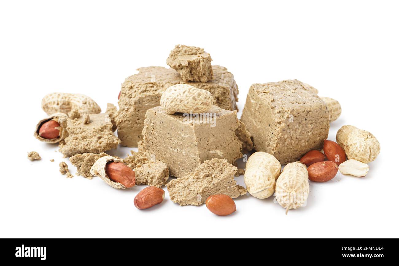 Pieces of sweet halva with peanuts on white background Stock Photo - Alamy
