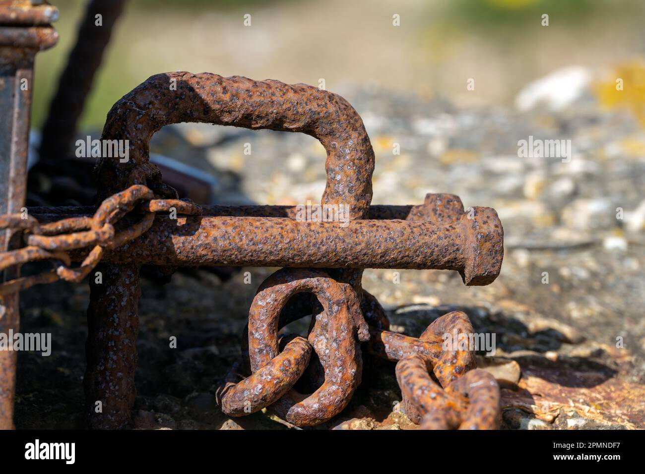 Detail of rusty chain and object Stock Photo - Alamy