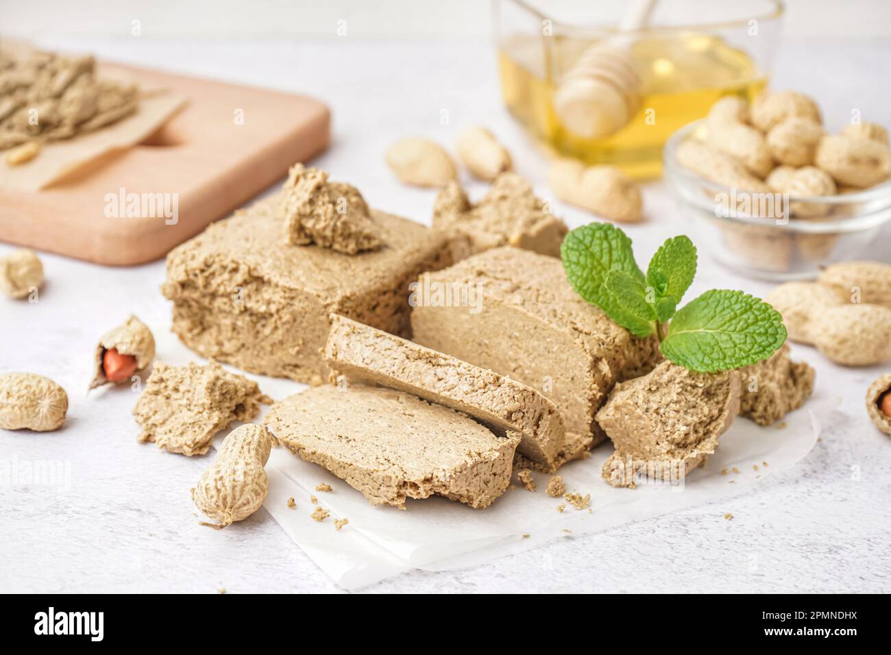 Pieces of sweet halva on light background Stock Photo - Alamy