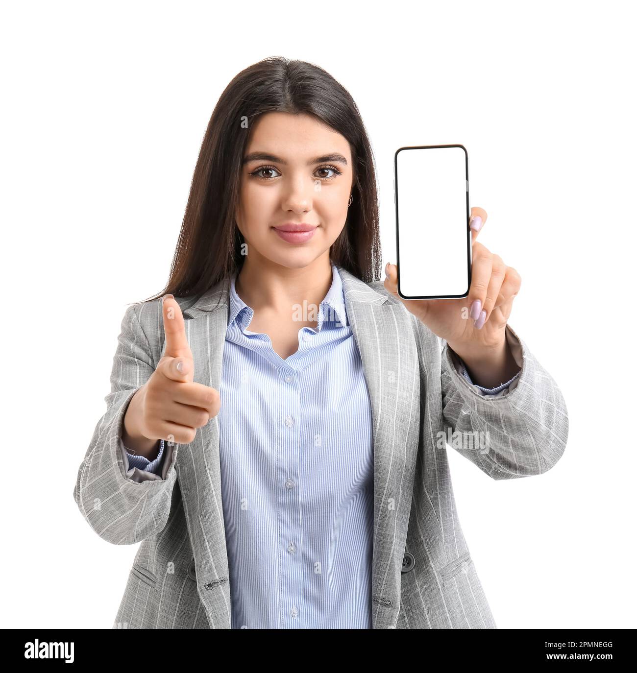 Cool young woman with smartphone pointing at viewer on white background ...