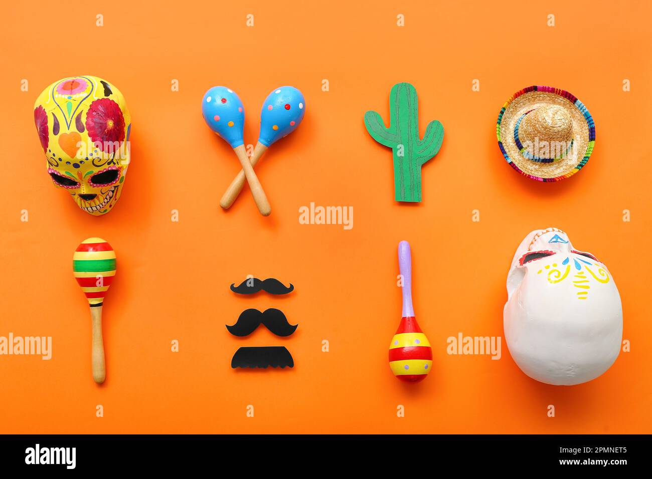 Mexican maracas with painted skulls, sombrero hat, paper mustaches and ...