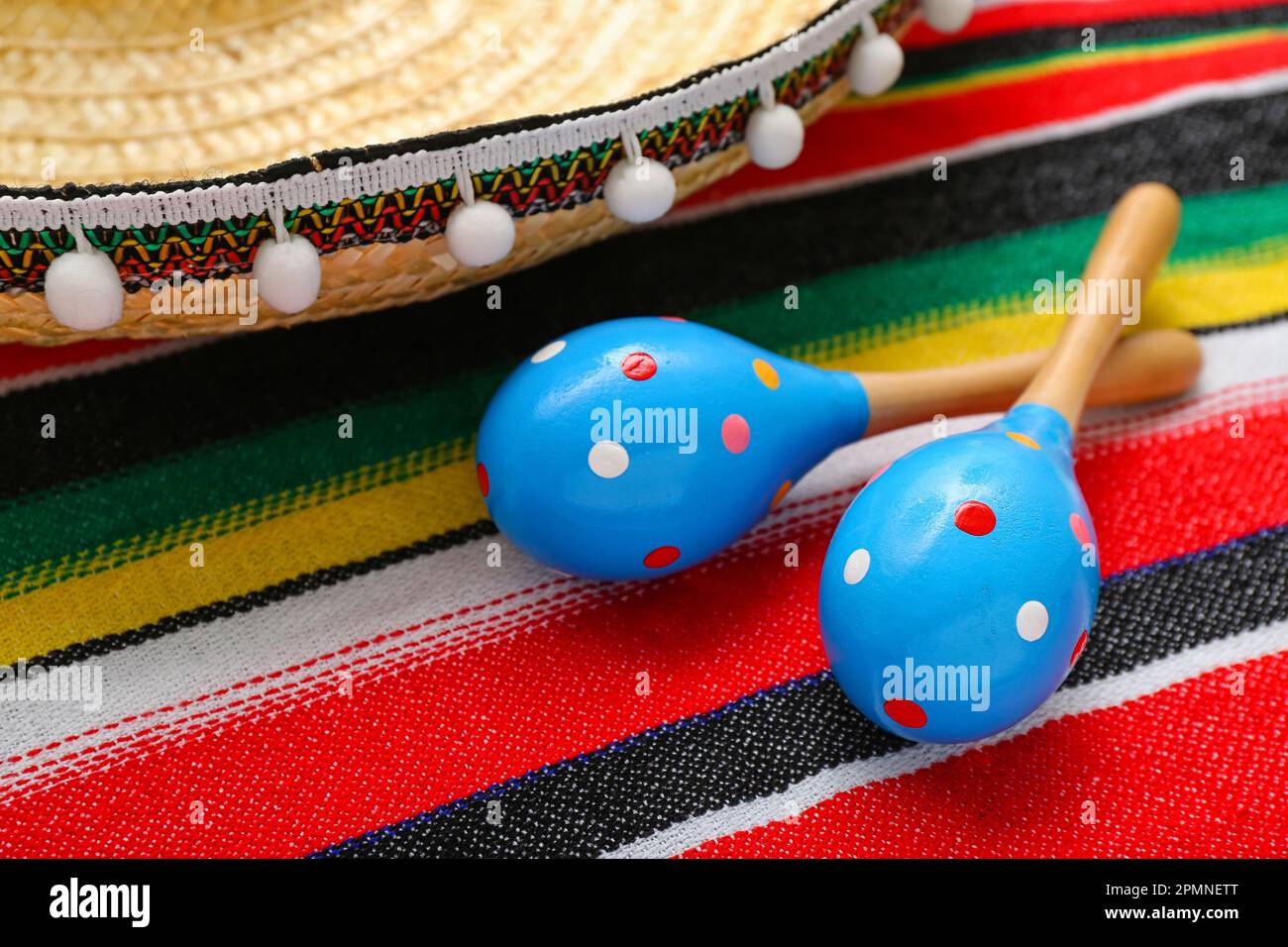 Mexican maracas with sombrero hat on colorful serape, closeup Stock ...