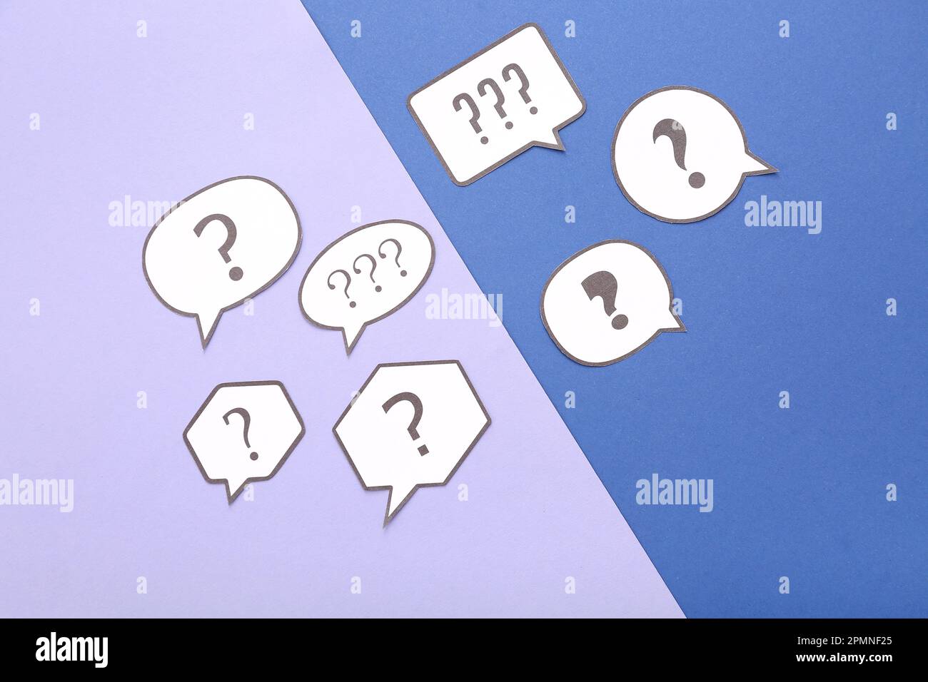 Speech bubbles with question marks on color background Stock Photo - Alamy