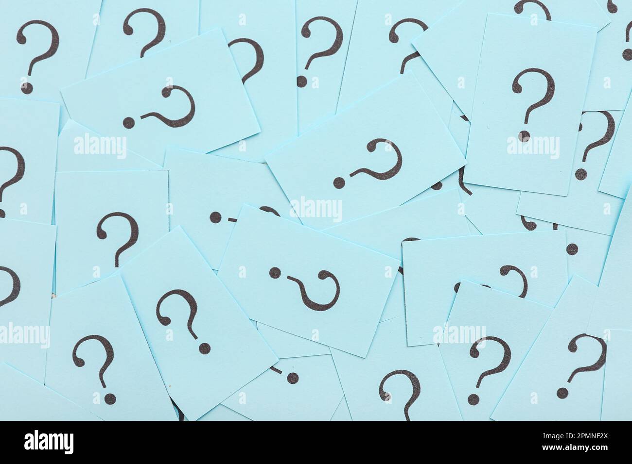Blue papers with question marks as background Stock Photo - Alamy