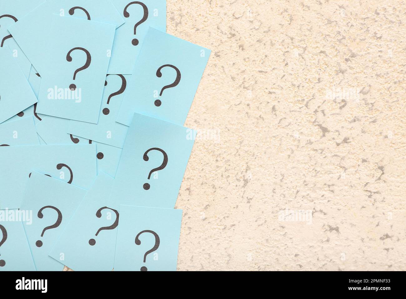 Papers with question marks on grunge background Stock Photo - Alamy
