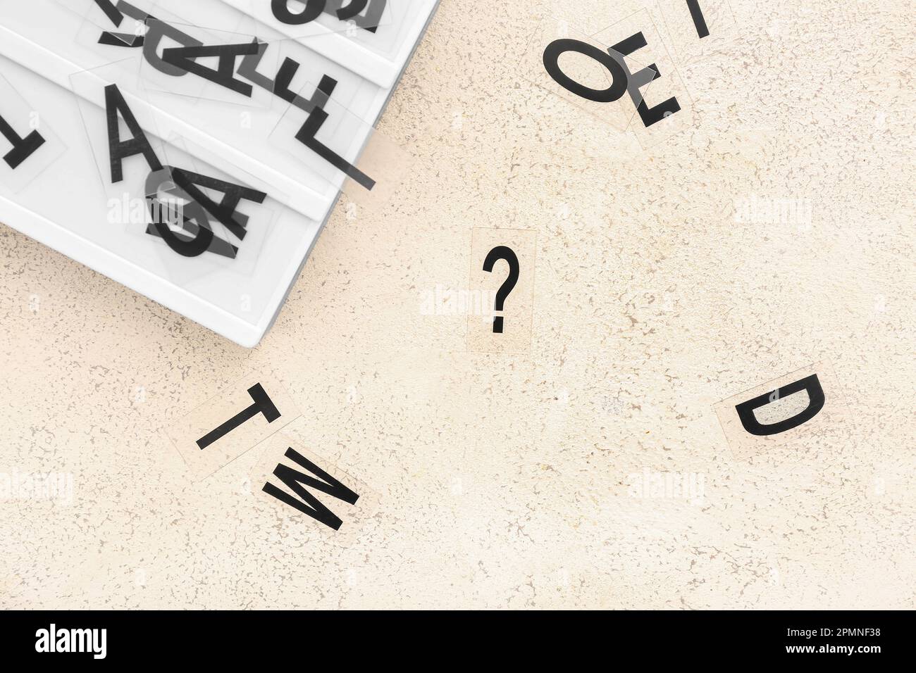 Board with letters and question mark on white background Stock Photo ...