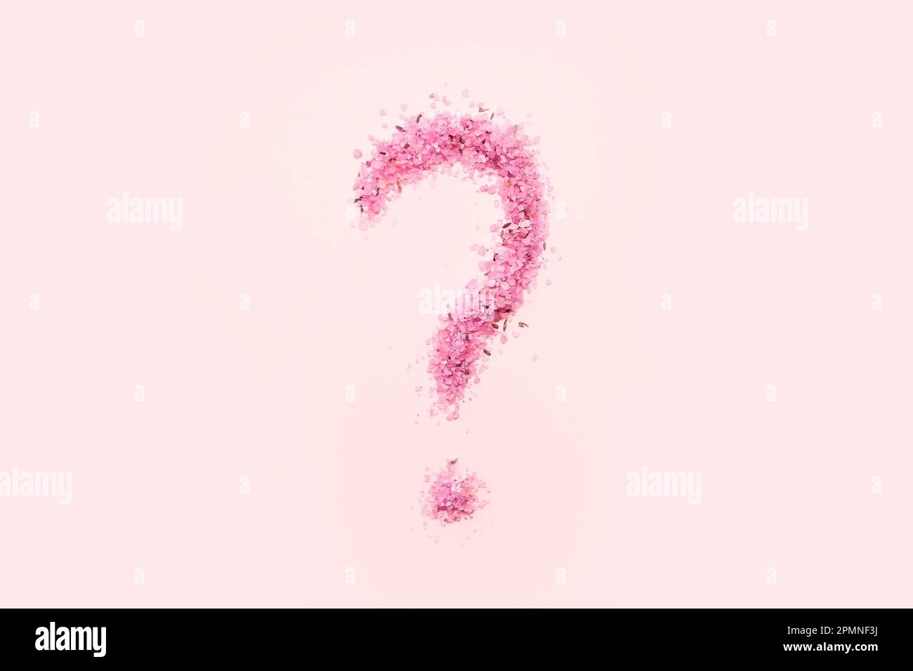 Question mark made of sea salt on pink background Stock Photo - Alamy