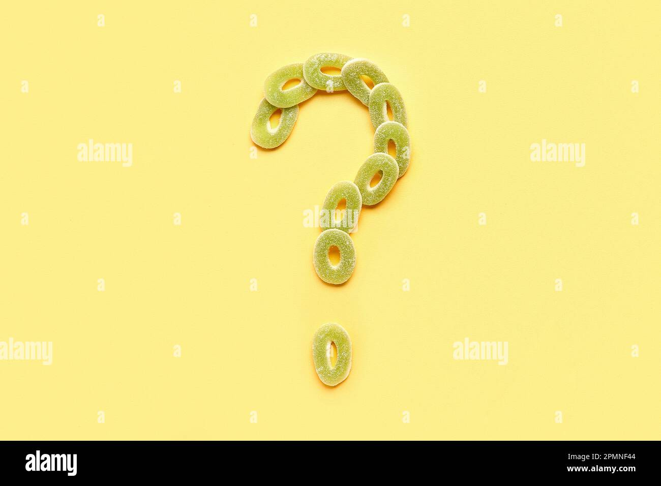 Question mark made of jelly candies on yellow background Stock Photo ...