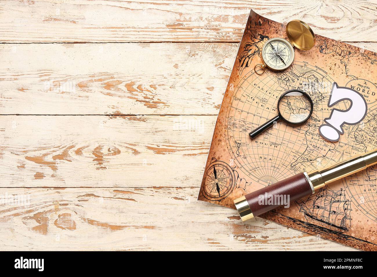 World map with question mark, spyglass, compass and magnifier on white ...