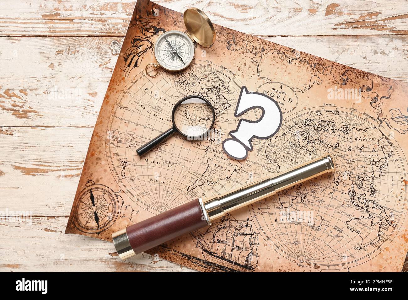 World map with question mark, spyglass, compass and magnifier on white ...