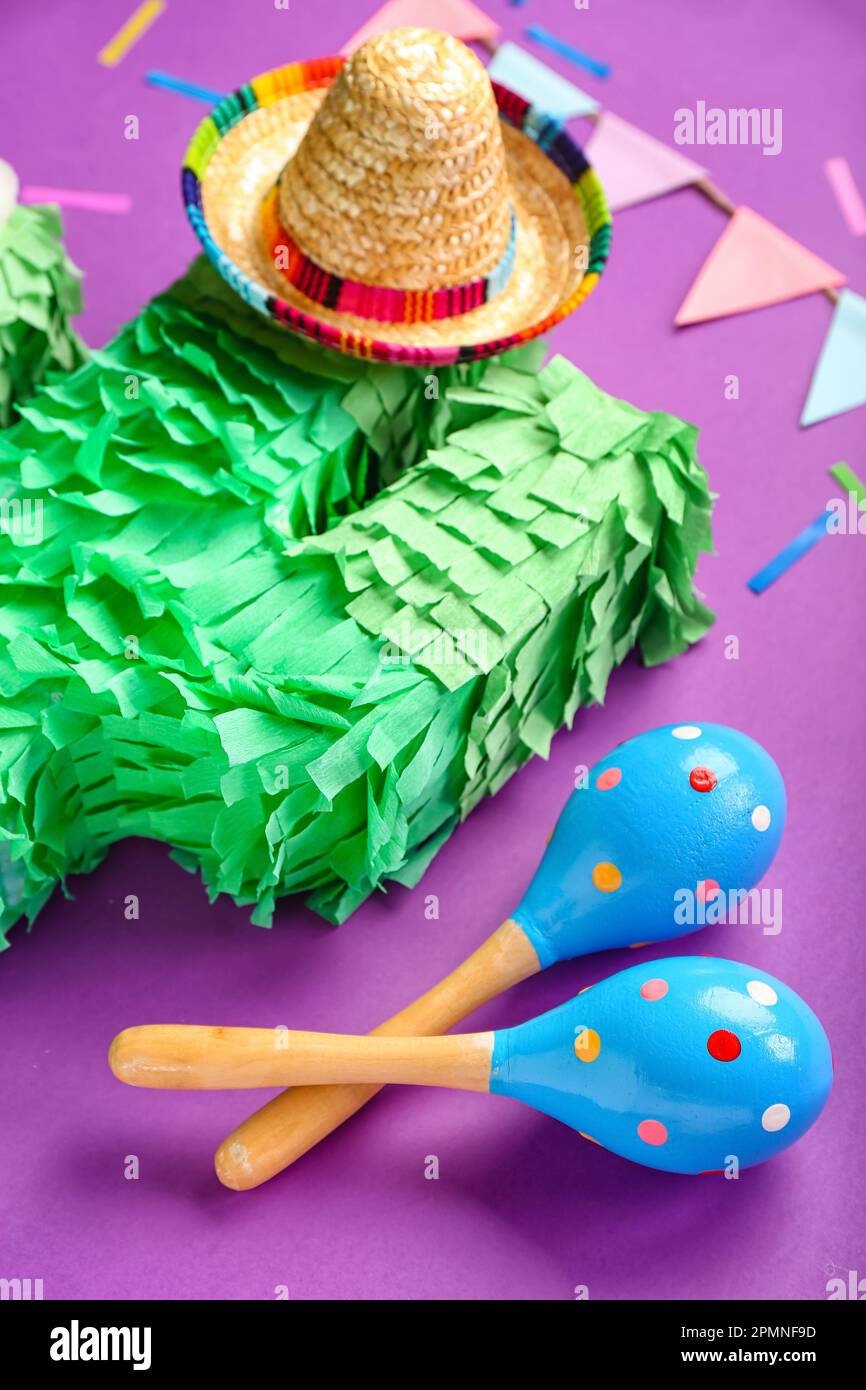 Mexican maracas with pinata, sombrero hat, paper flags and confetti on ...