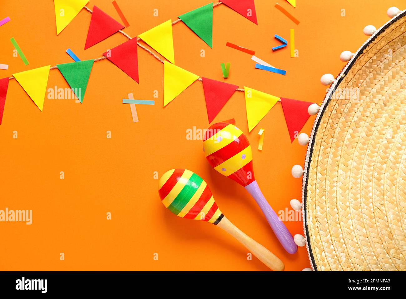 Mexican maracas with sombrero hat, flags and confetti on color ...