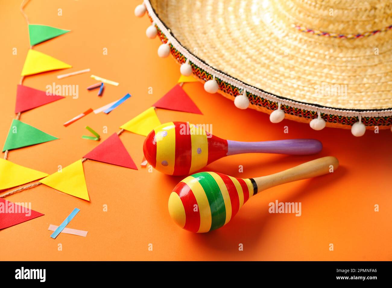 Mexican maracas with sombrero hat, flags and confetti on color ...