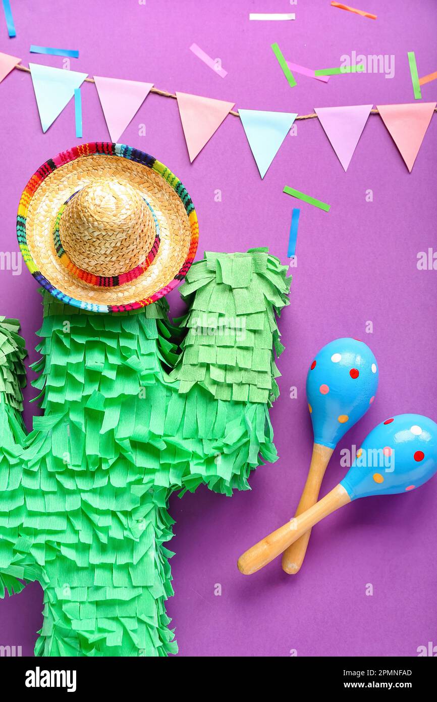 Mexican maracas with pinata, sombrero hat, paper flags and confetti on ...