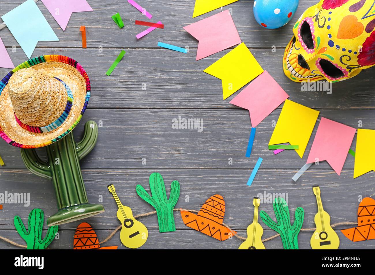 Frame made of Mexican symbols with flags on dark wooden background ...