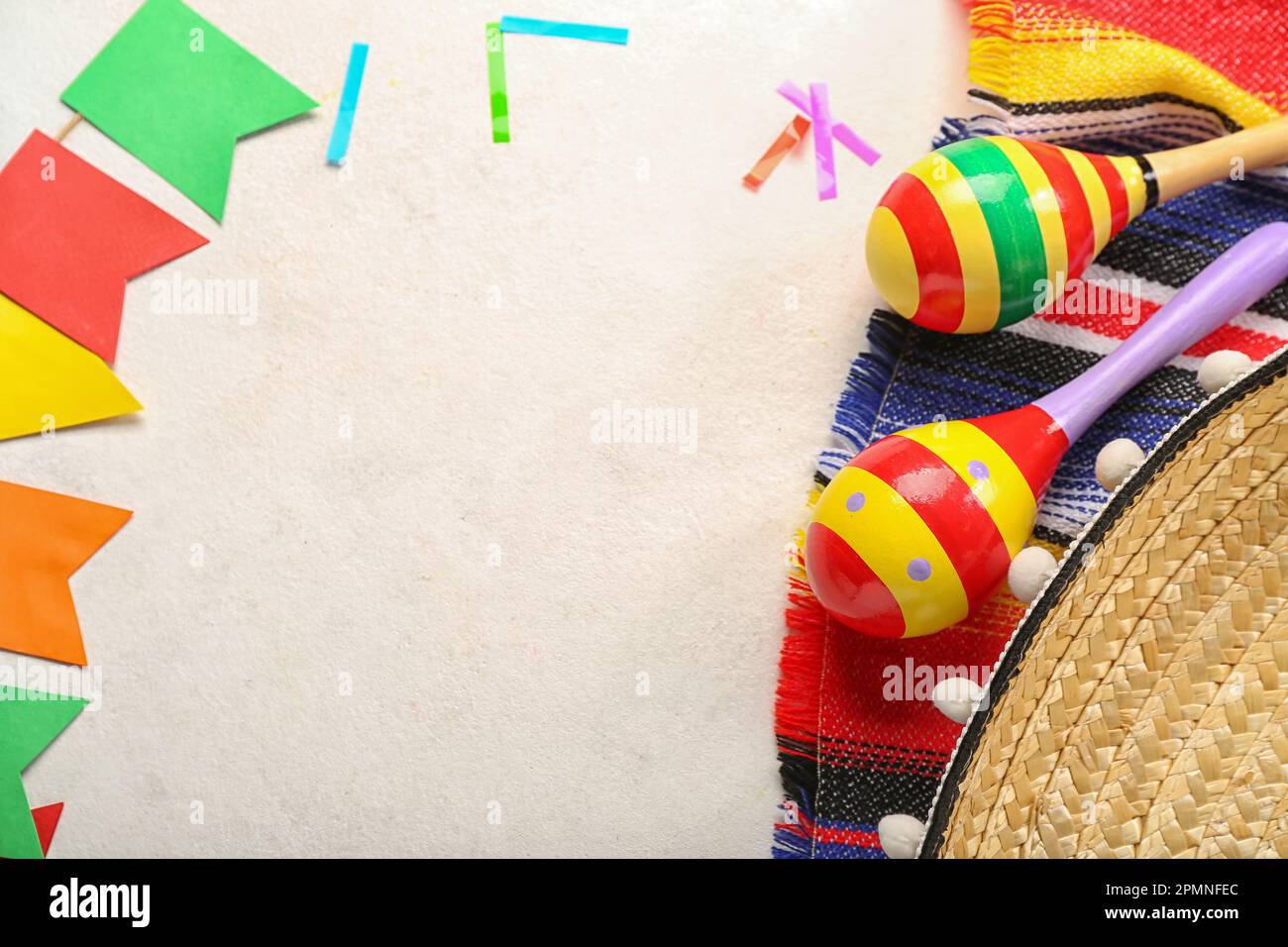 Frame made of Mexican maracas with flags and confetti on white ...