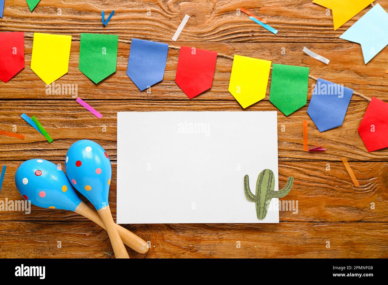 Blank card with Mexican maracas, flags and confetti on wooden ...