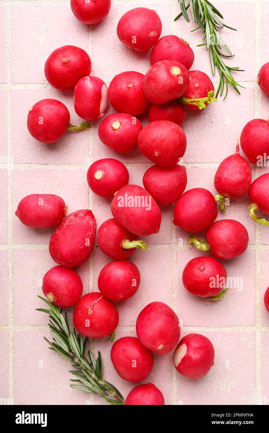 Fresh radish on pink tile background Stock Photo - Alamy