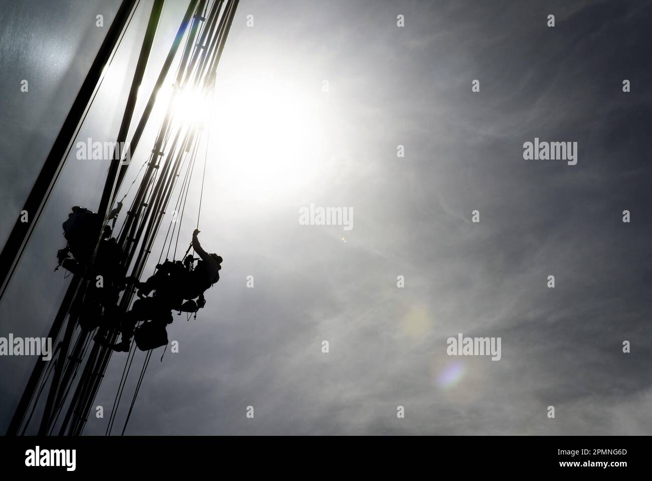 ROTTERDAM - 14/04/2023, Abseilers hang on the 57th floor of the ...