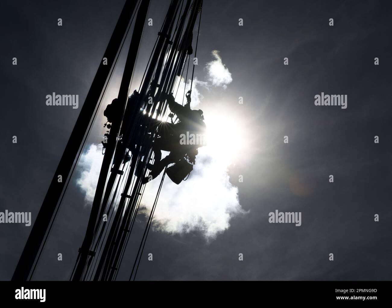 ROTTERDAM - 14/04/2023, Abseilers hang on the 57th floor of the ...