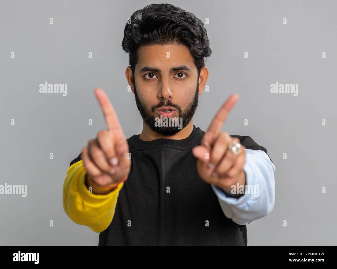 Indian handsome man shakes finger and saying No, be careful, scolding ...