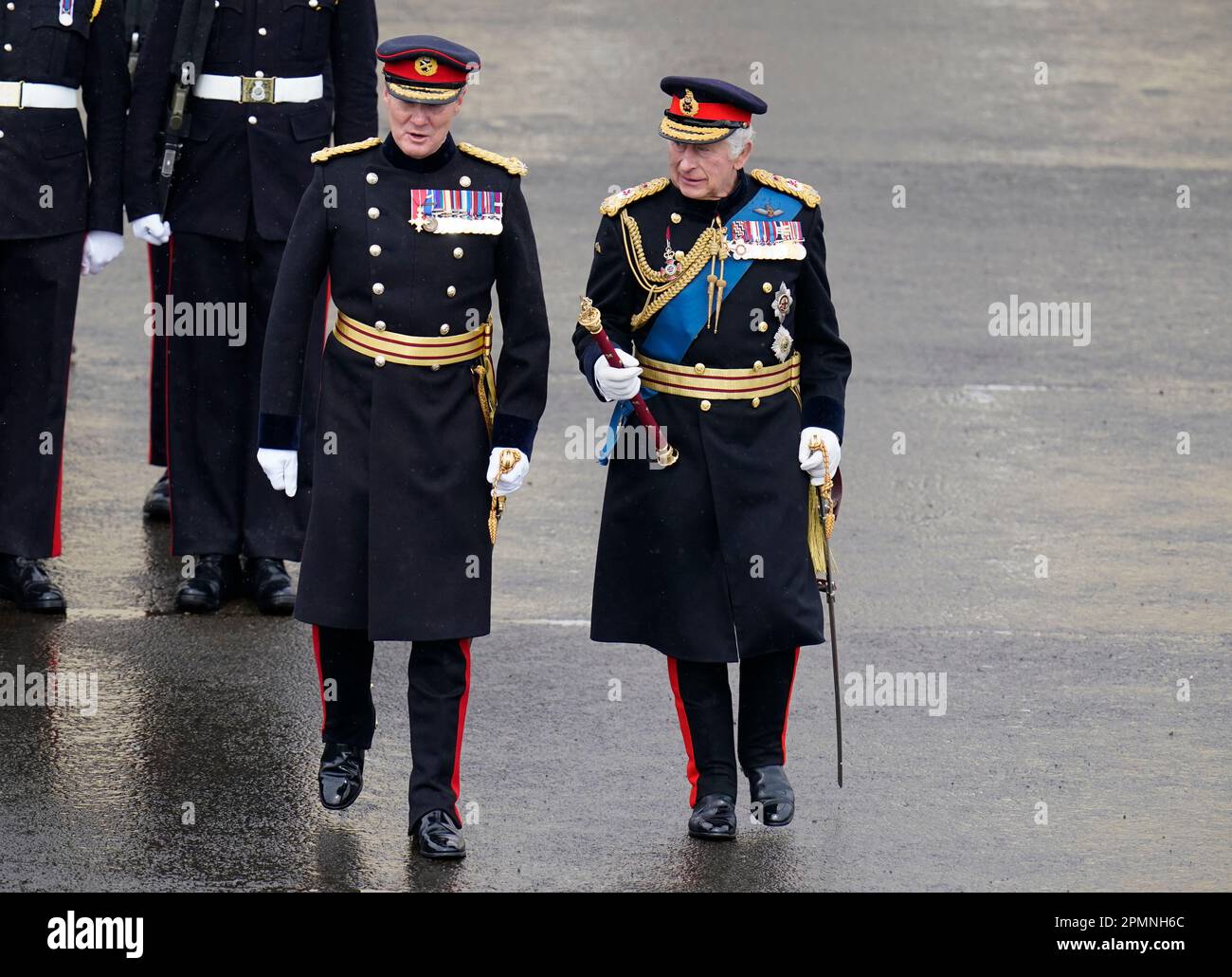 King Charles III (right) inspects Officer Cadets on parade during the ...